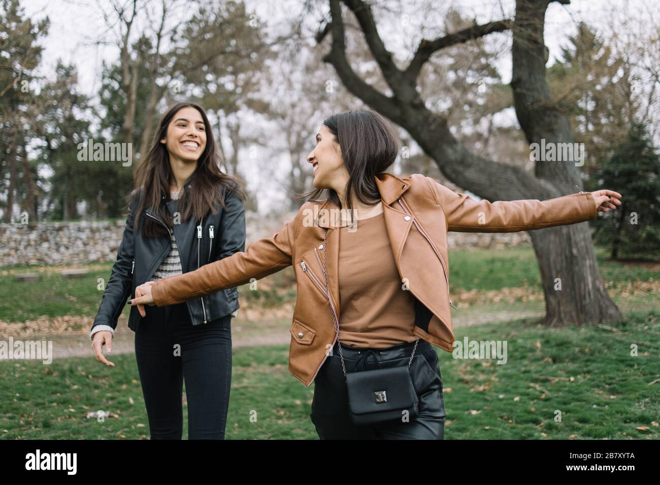 Happy girls laughing and having fun in nature Stock Photo - Alamy