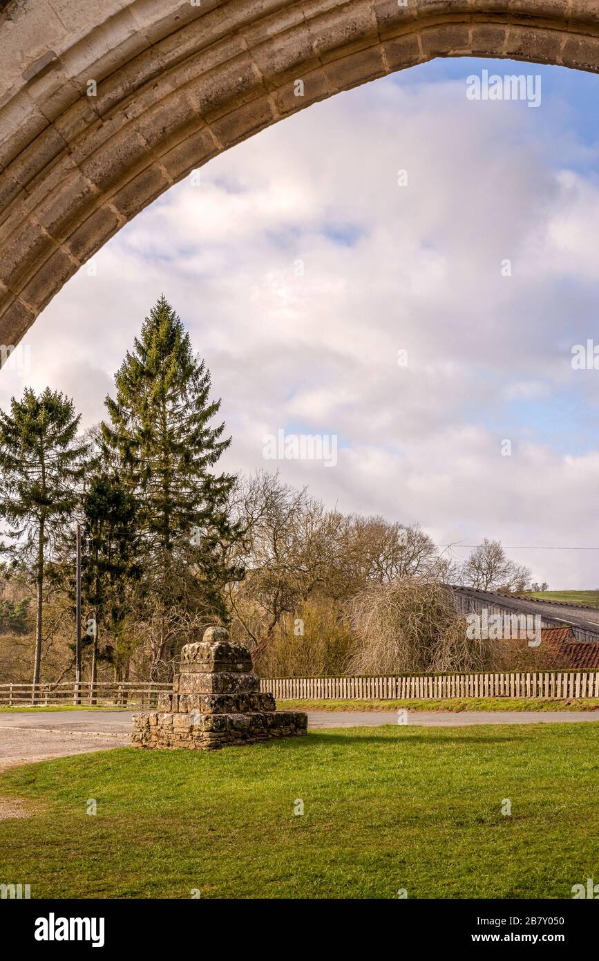 An ancient monument by the entrance of Kirham Priory in Yorkshire. A ...