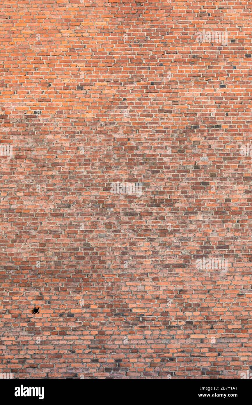 Old messy brick wall texture background exterior Stock Photo - Alamy