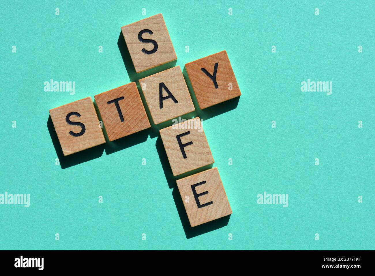 Stay Safe, words in 3d wood alphabet letters on blue Stock Photo - Alamy