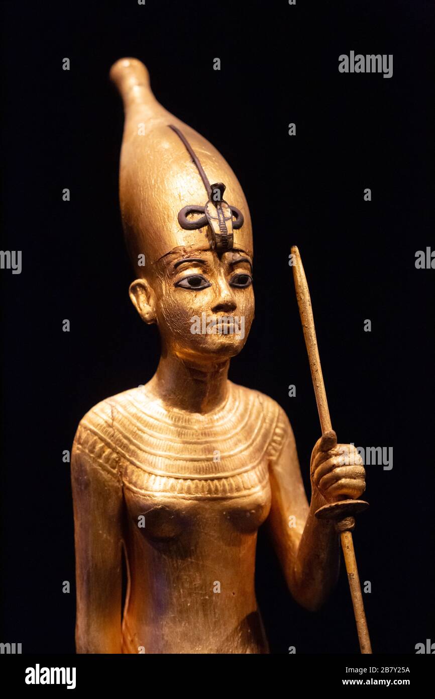 Tutankhamun statue; close up of a gilded wooden statue of the king ...