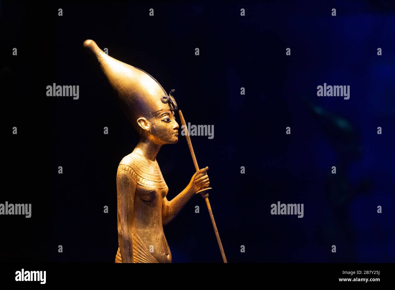 Tutankhamun statue; close up of a gilded wooden statue of the king ...