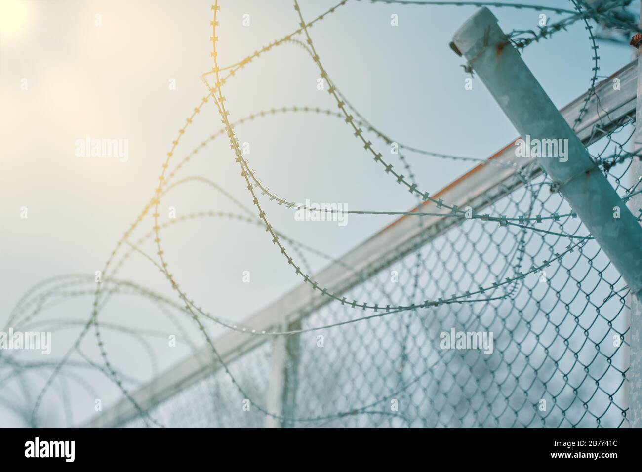 Border fence with barbed wire. Closing for quarantine. Maximum Security ...