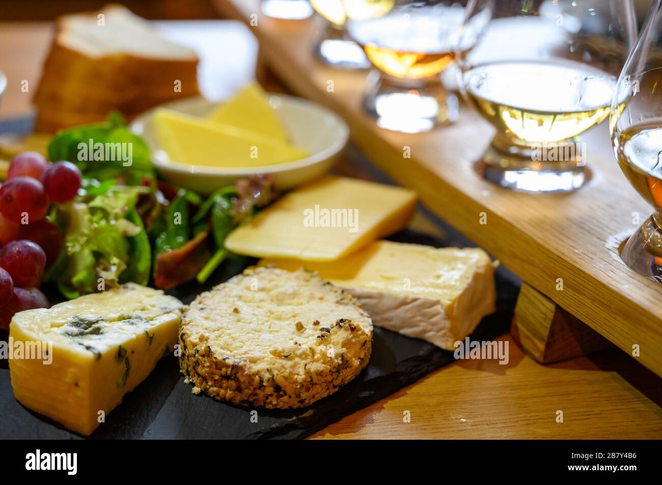 Tasting of original scottish cheese and whisky, plate with scottish ...