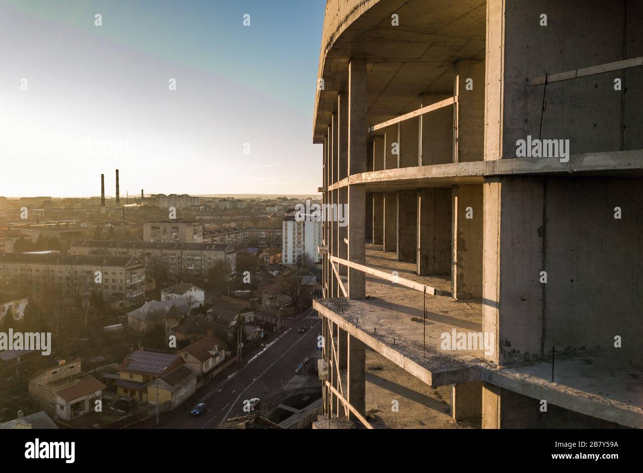 Aerial view of concrete frame of tall apartment building under ...