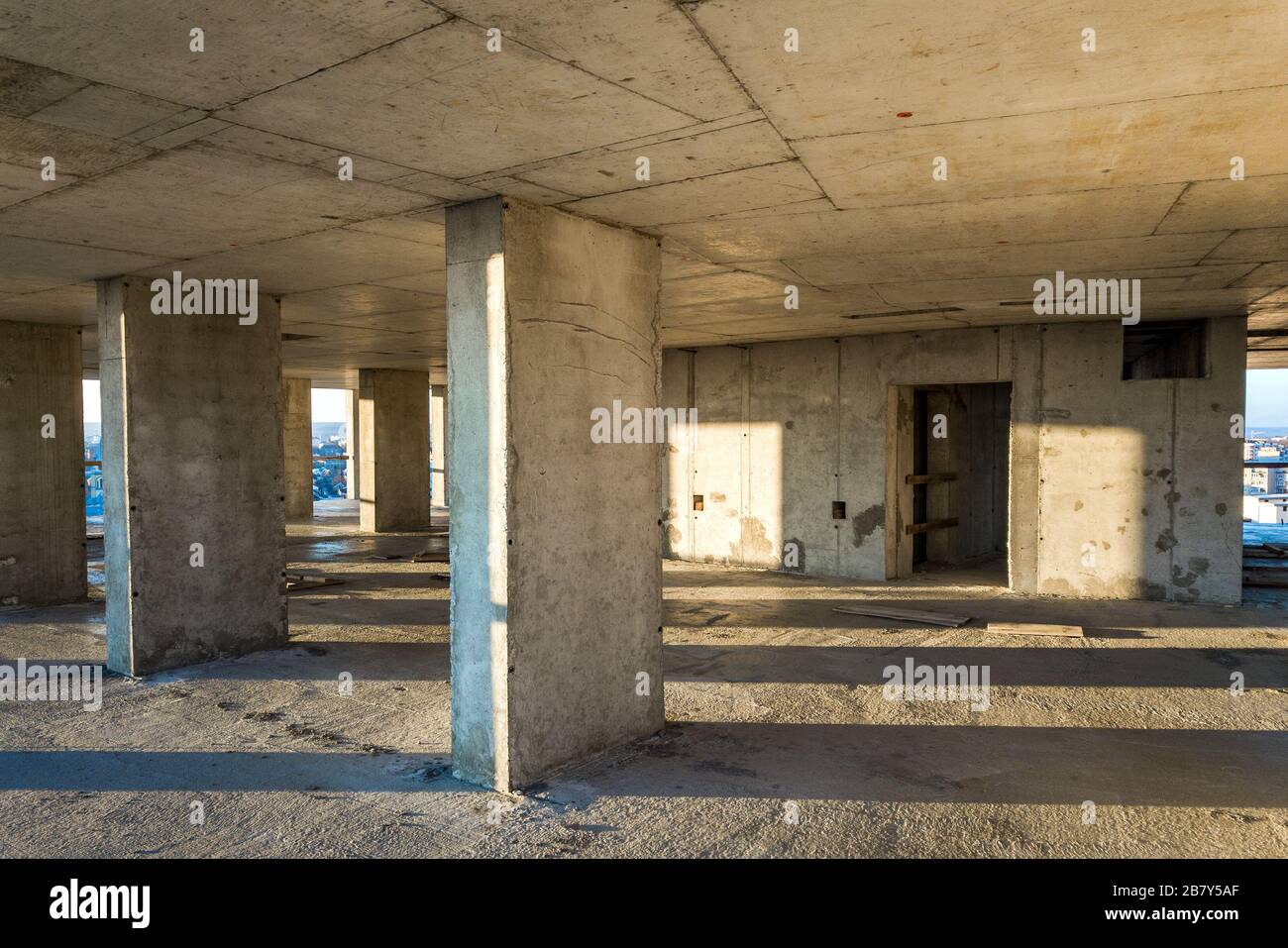 Interior of a concrete residential apartment building room with ...