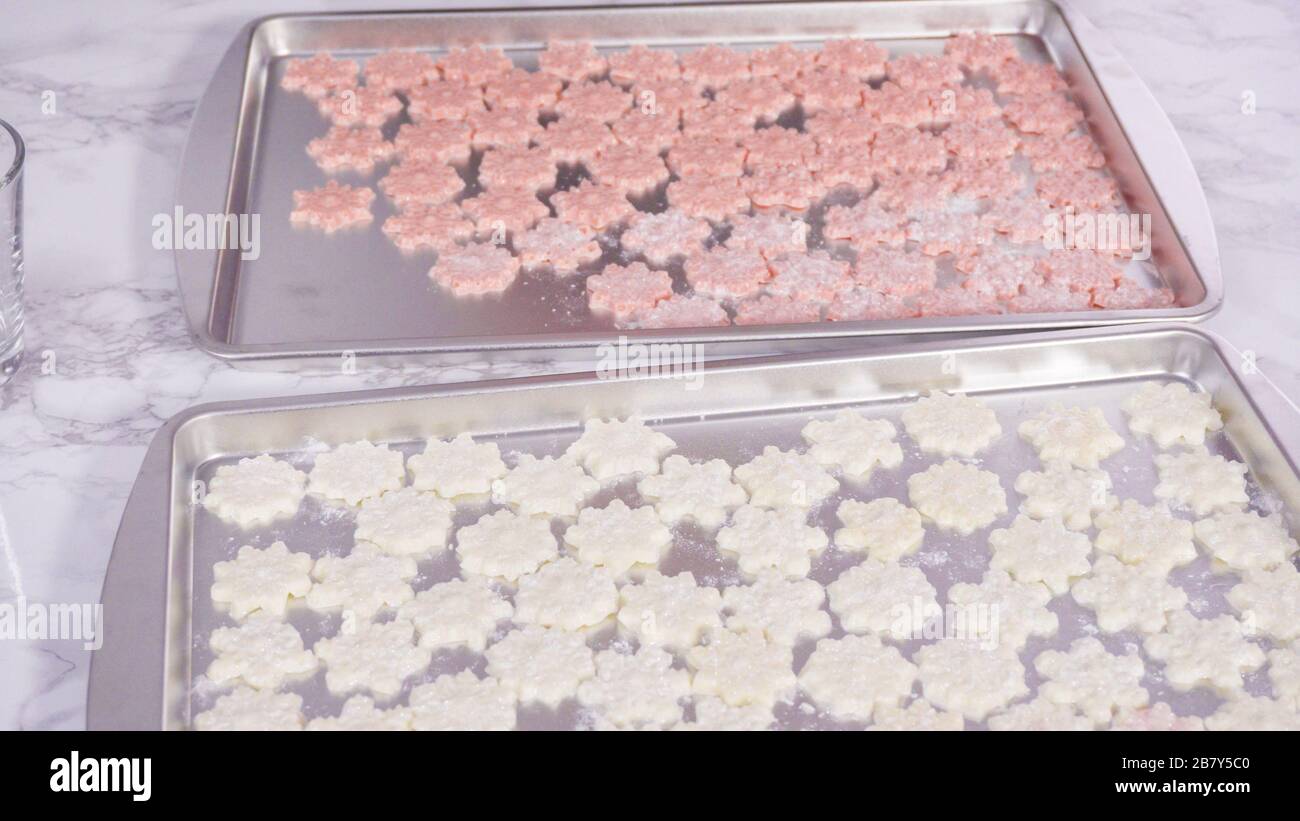 Step by step. Dusting chocolate snowflakes with glittery food dust ...