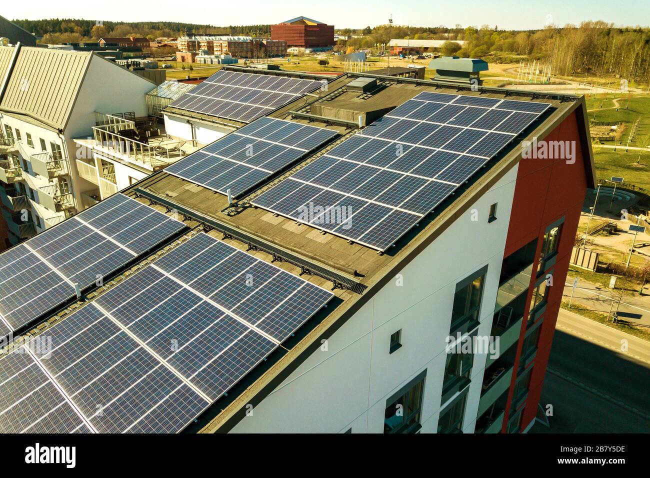 Aerial view of solar photovoltaic panels on a roof top of residential ...