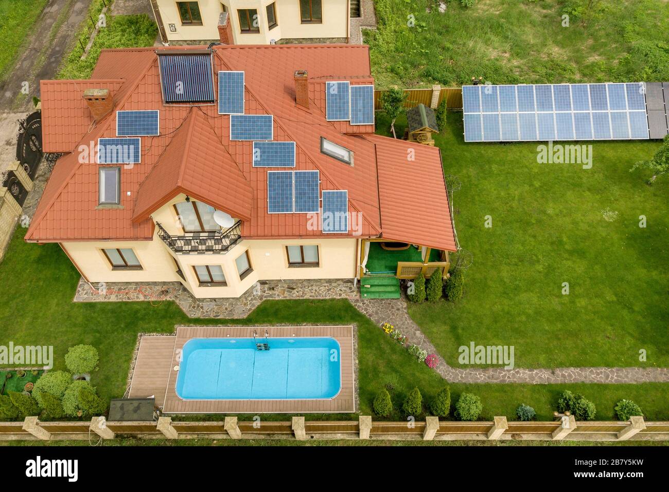 Aerial view of a new autonomous house with solar panels and water ...