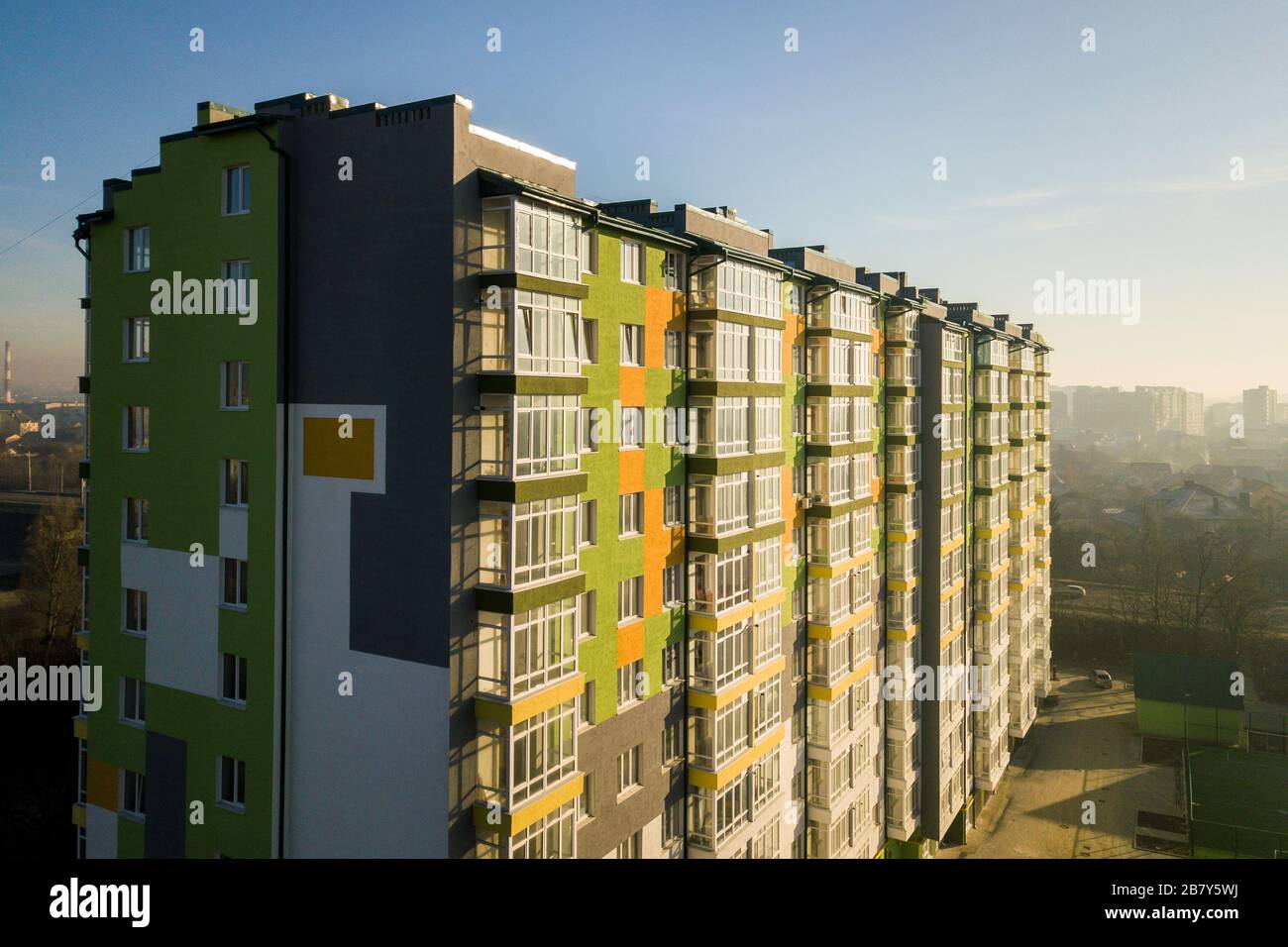 Aerial view of a tall residential apartment building with many windows ...