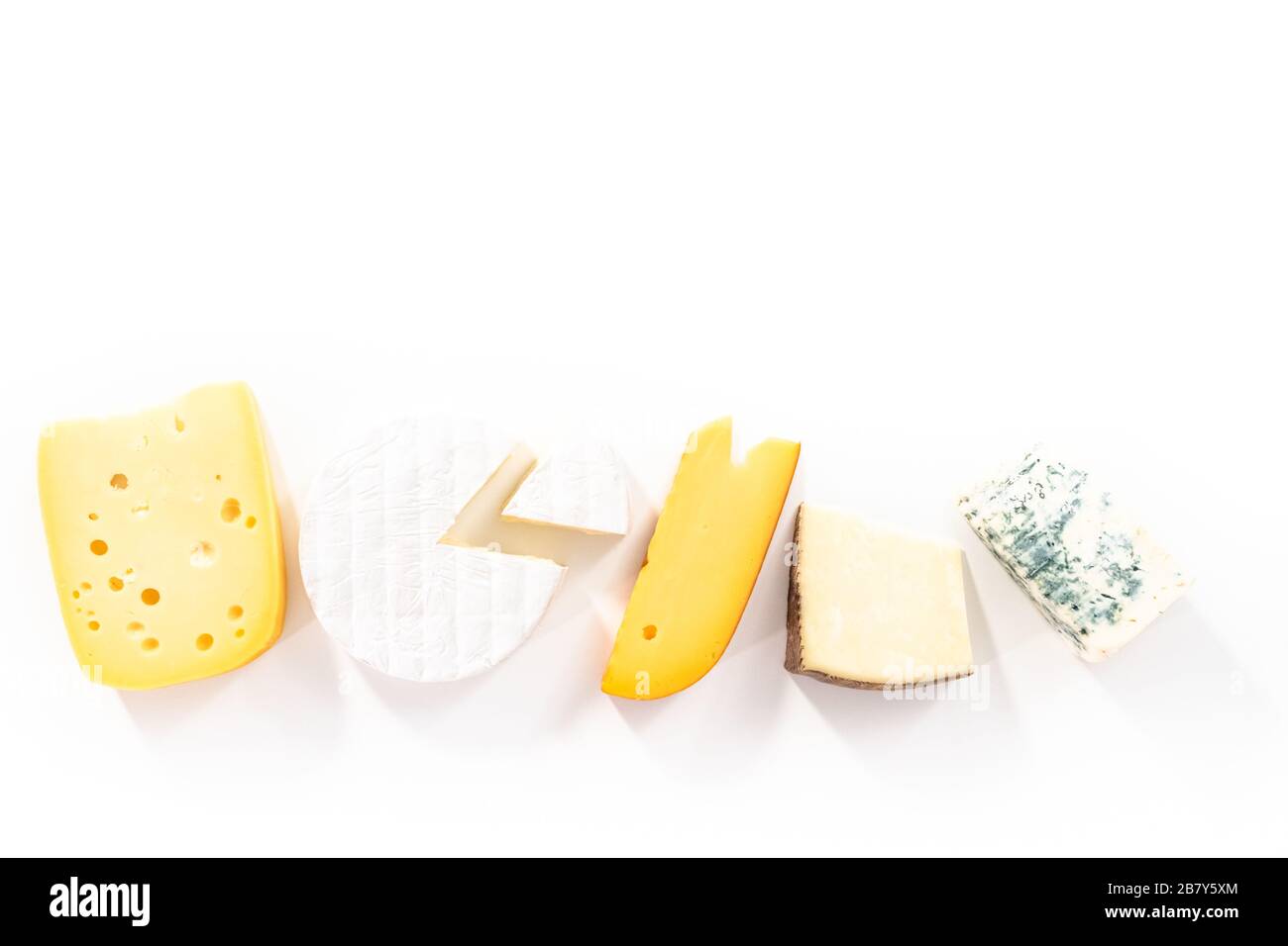 Variety of large wedges gourmet cheese on a white background Stock ...