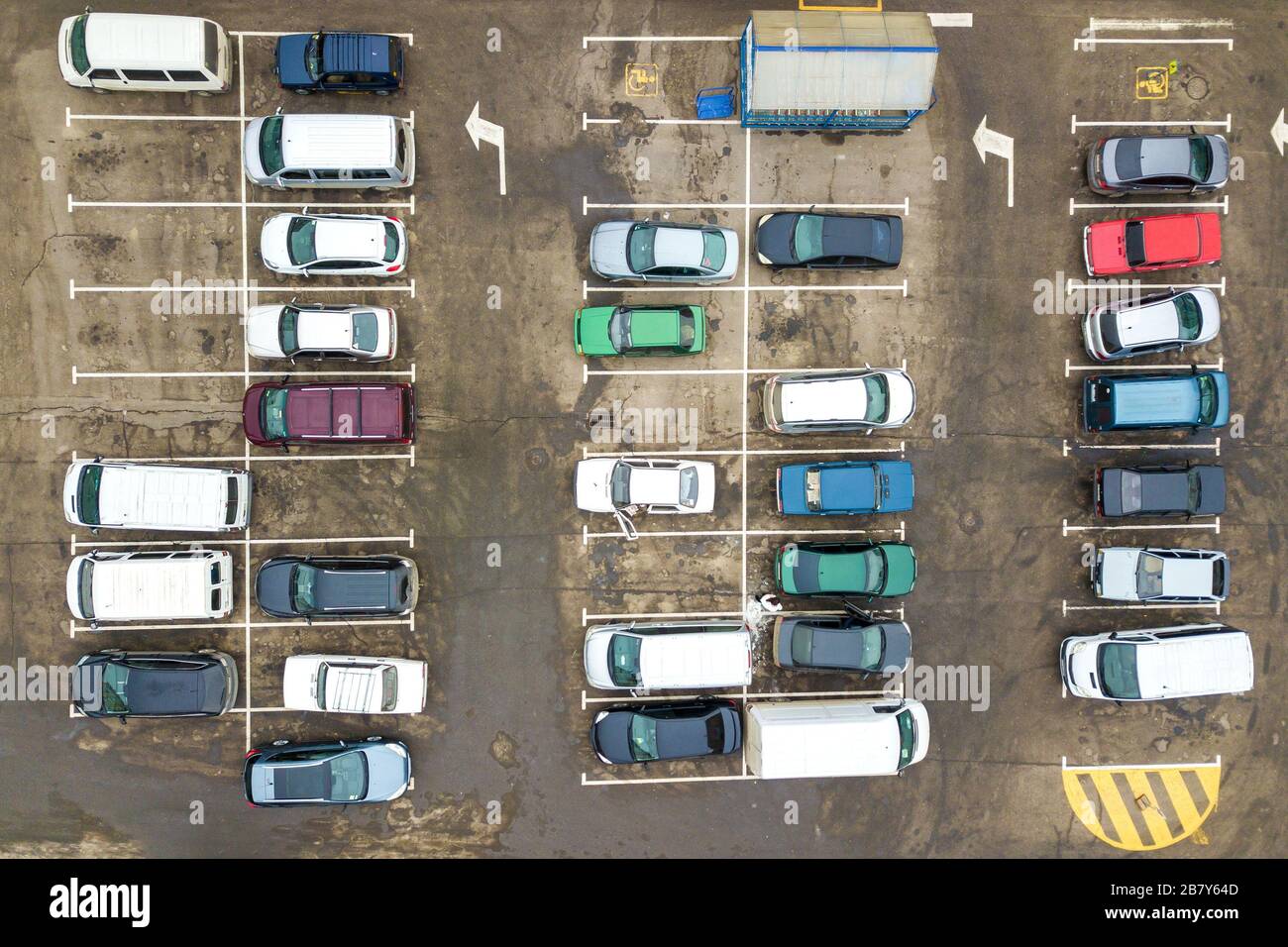Top down aerial view of many cars on a parking lot of supermarket or on ...