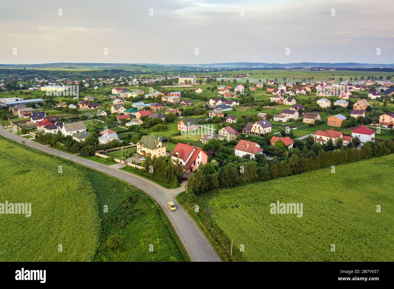 Aerial landscape of small town or village with rows of residential ...