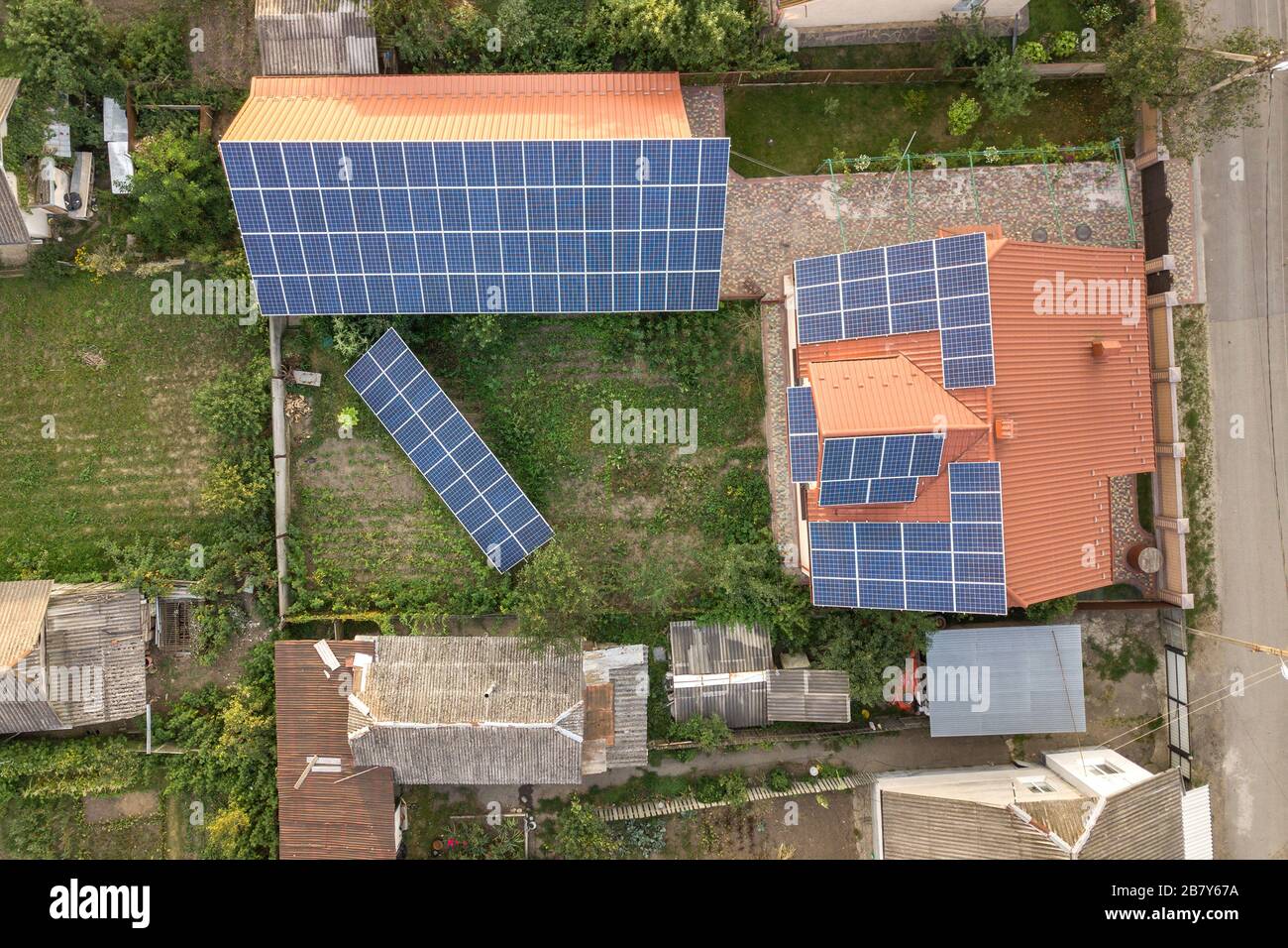 Aerial top view of new modern residential house cottage with blue shiny ...