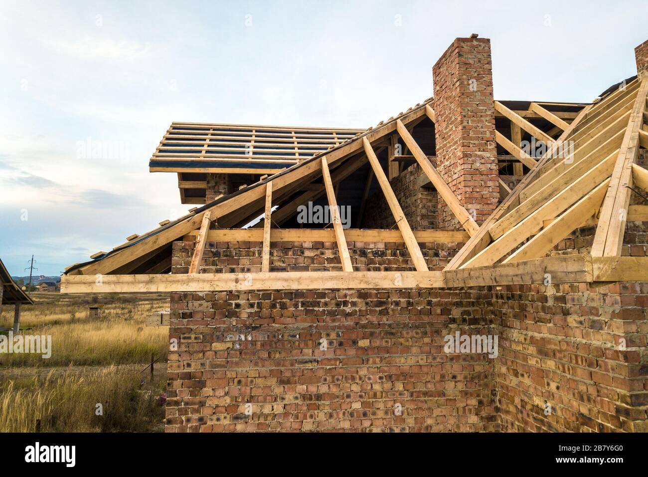 Private residential house with wooden roof frame structure under ...
