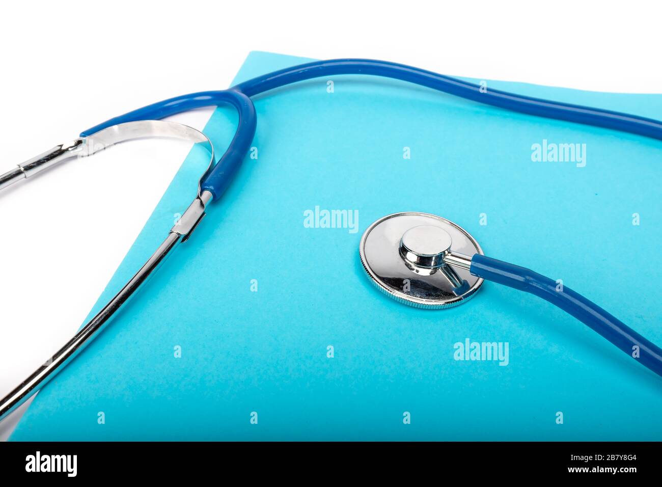 medical record and blue stethoscope close-up on white background in ...