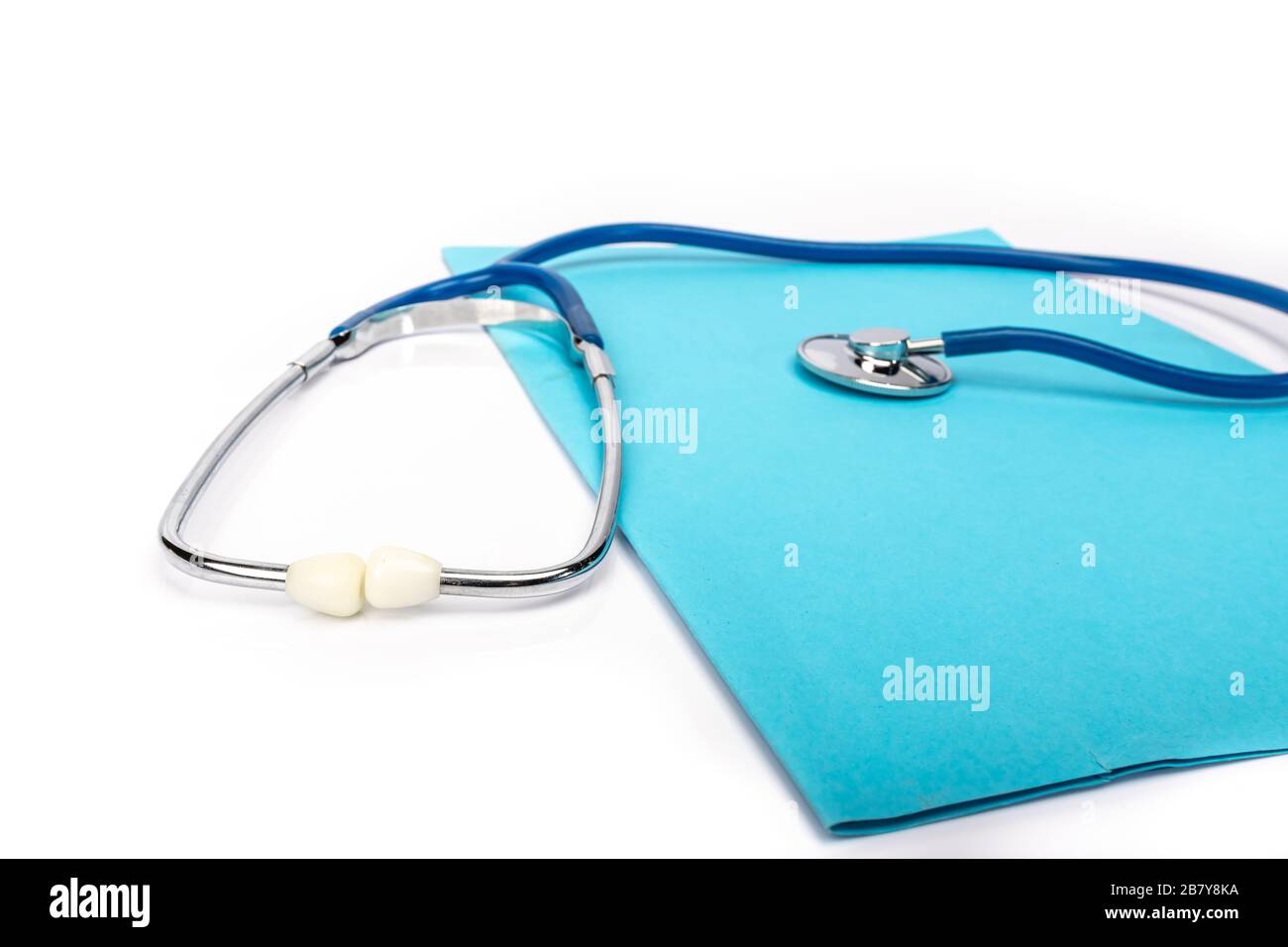 medical record and blue stethoscope close-up on white background in ...