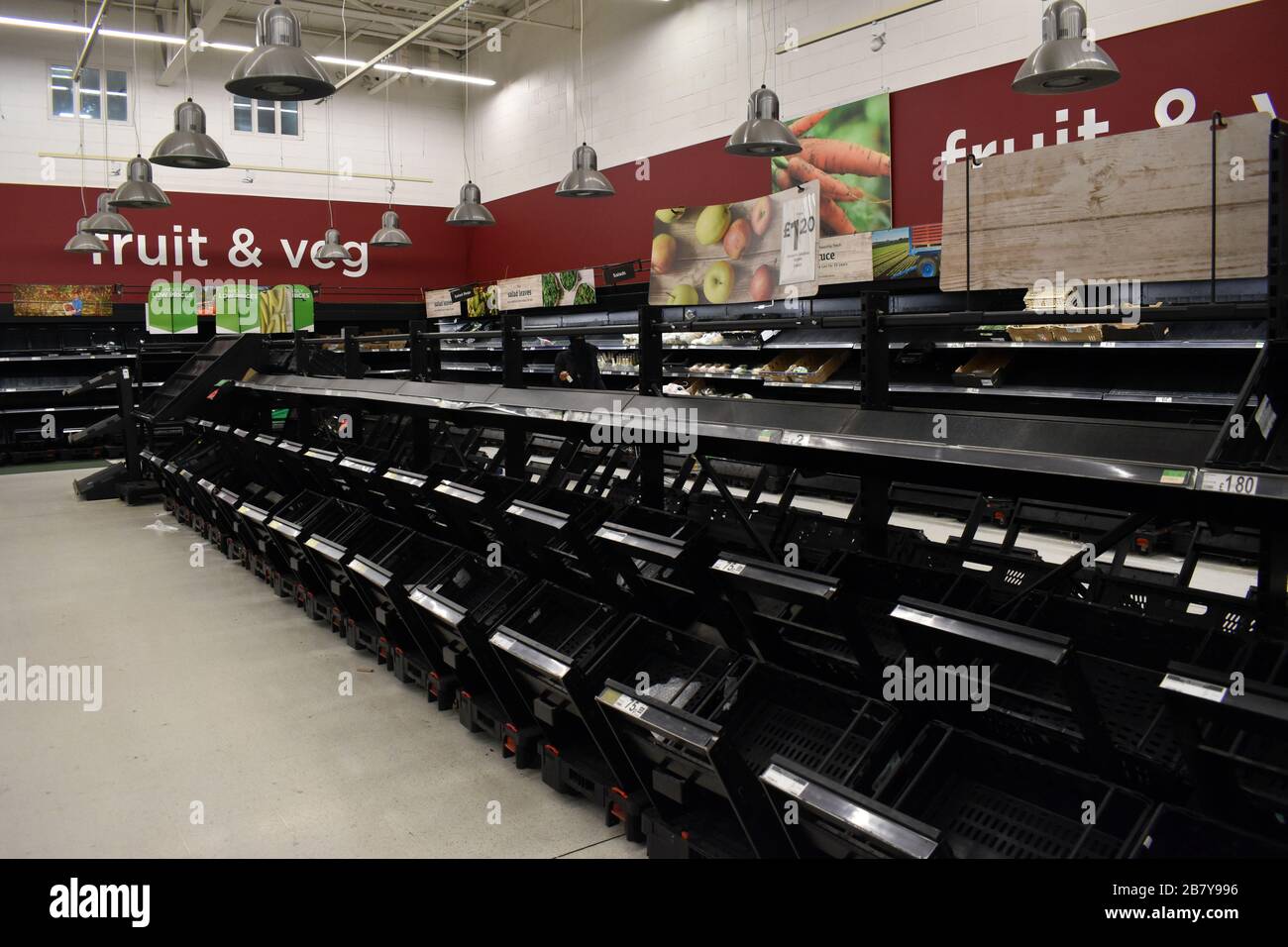 London, UK. 18th Mar, 2020. Empty fruit and vegetable shelves in Asda ...