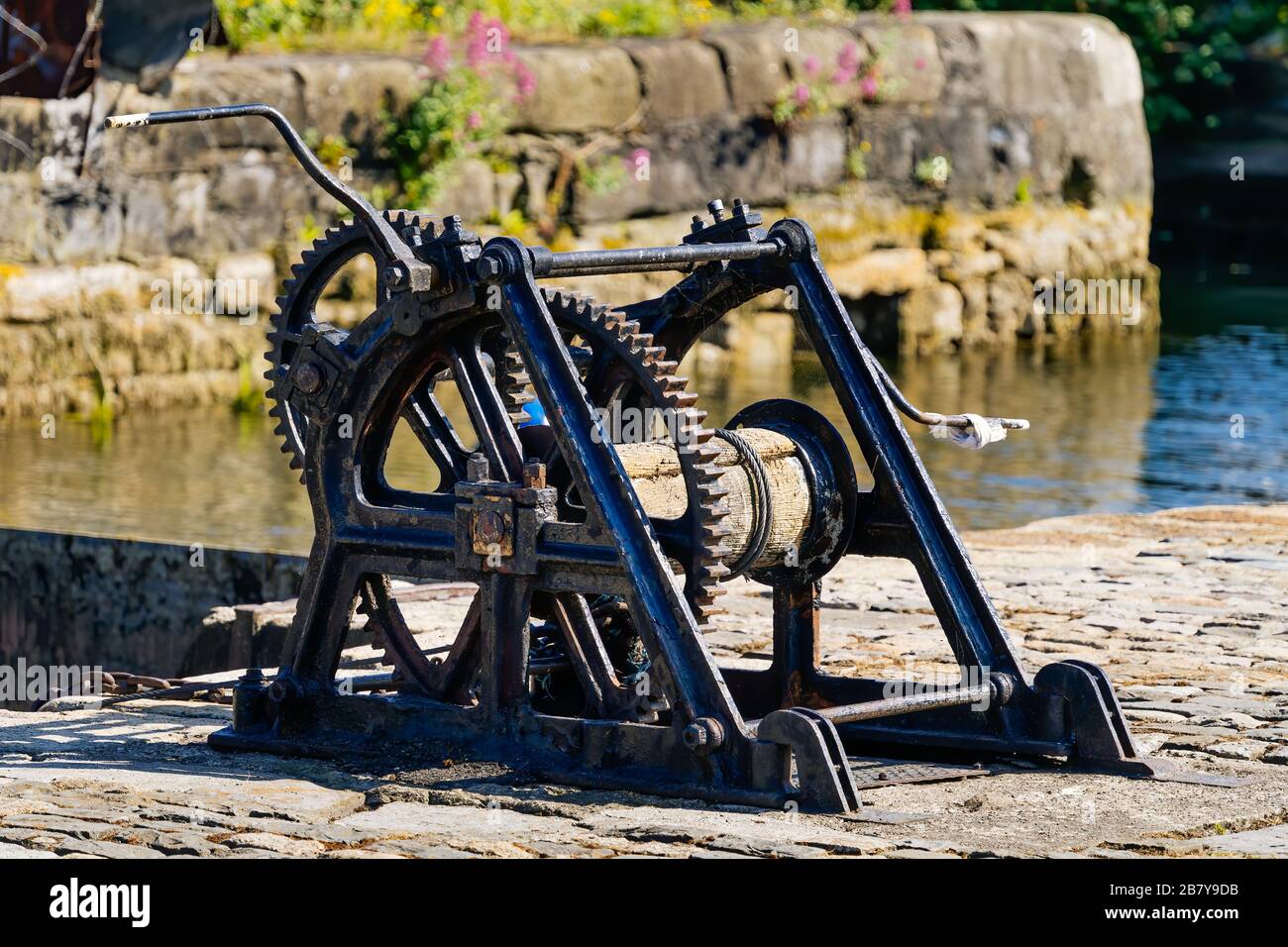 Old, vintage and rusted dam closing mechanism with cogwheels in Grand ...