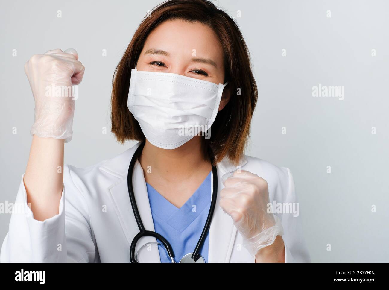 asian doctor wear the medical mask to protect and fight infection from ...
