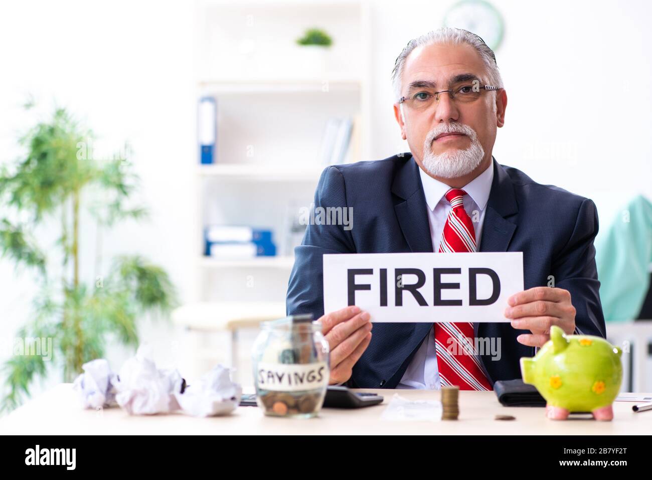 Old accountant in budget planning concept Stock Photo - Alamy