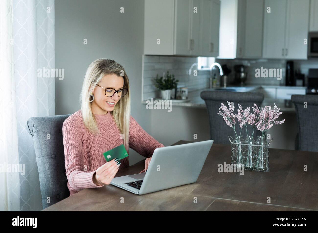 A Young and Beautiful Woman shopping online Stock Photo - Alamy
