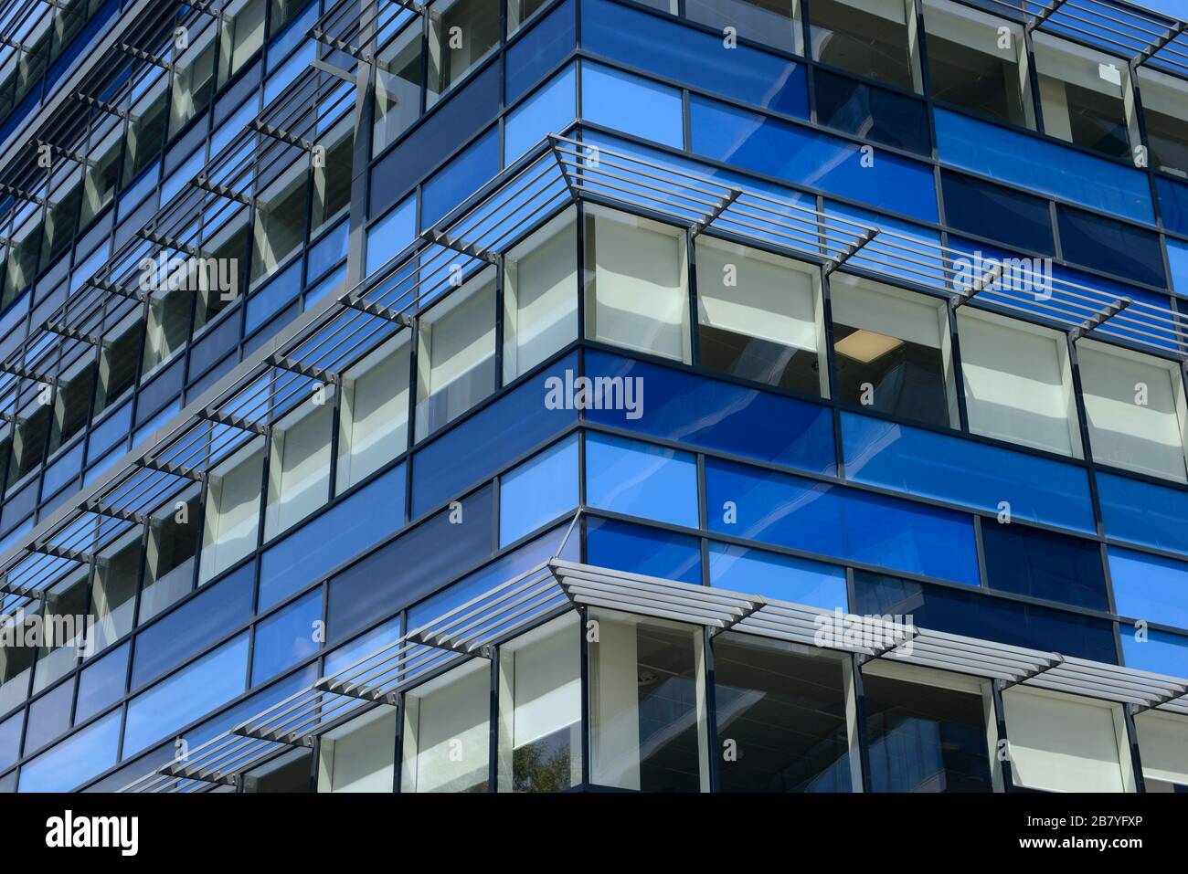 The corner of a blue glass office building in Temple Quay near Temple ...