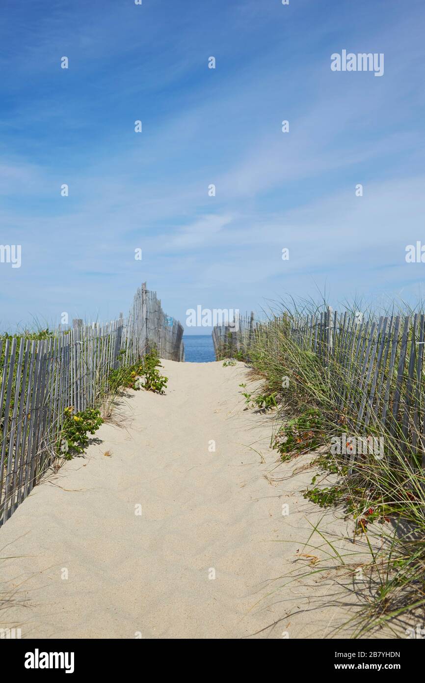 Wooden fence and path to beach Stock Photo - Alamy