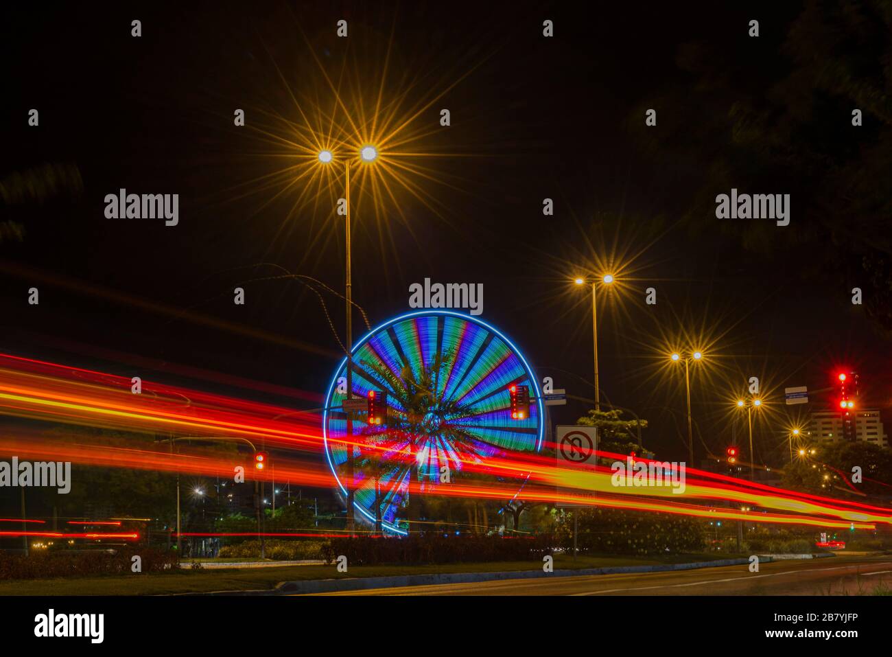 Long exposure of colorful ferris wheel and light trails on the ...