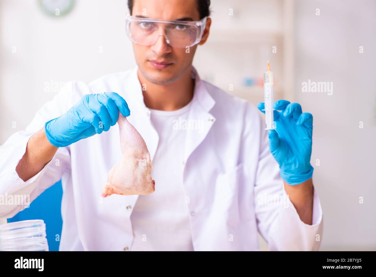 Young nutrition expert testing food products in lab Stock Photo - Alamy