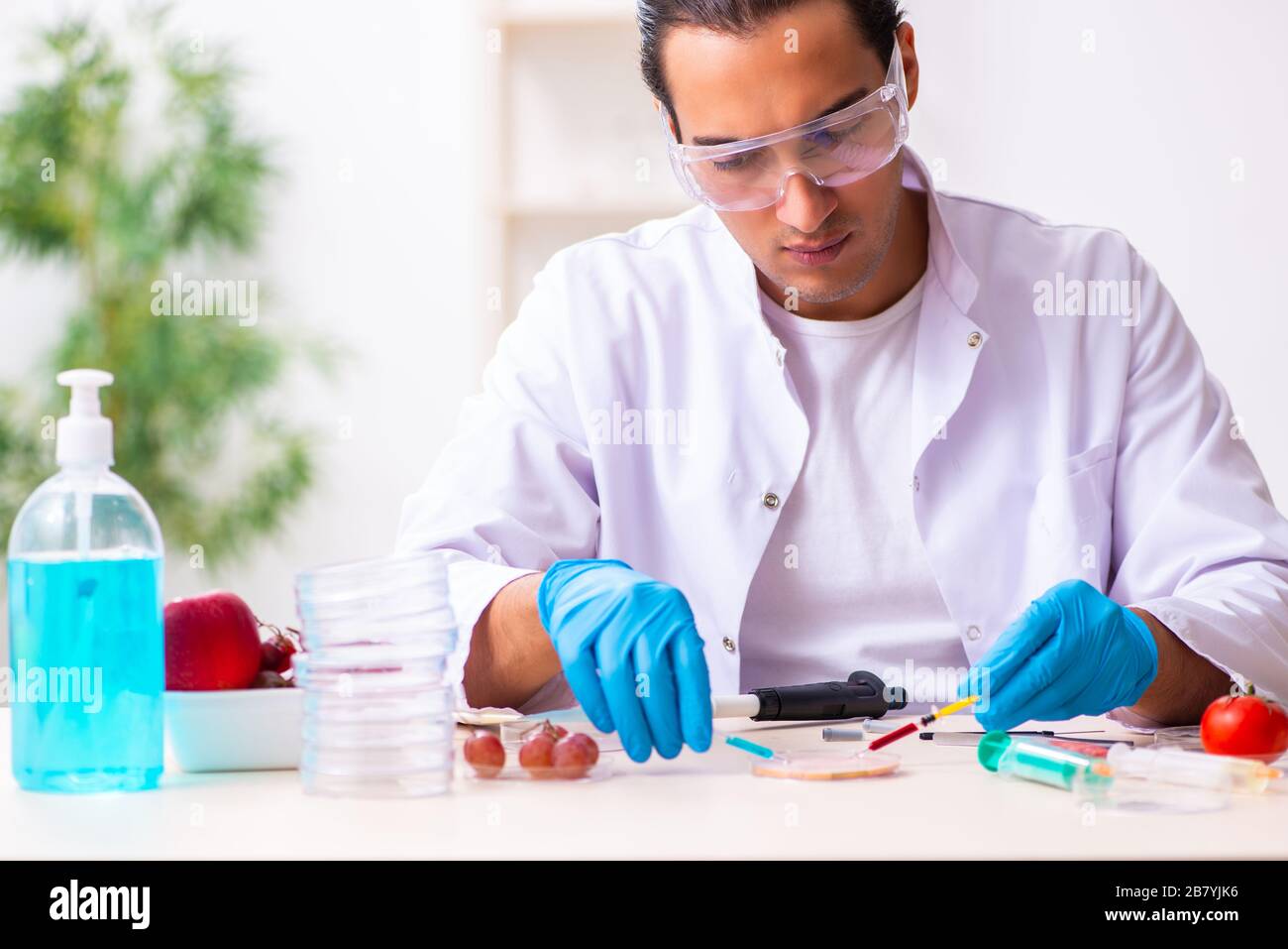 Young nutrition expert testing food products in lab Stock Photo - Alamy