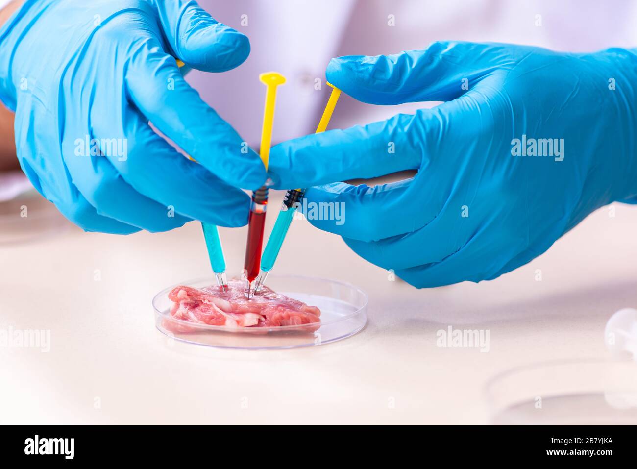Young nutrition expert testing food products in lab Stock Photo - Alamy