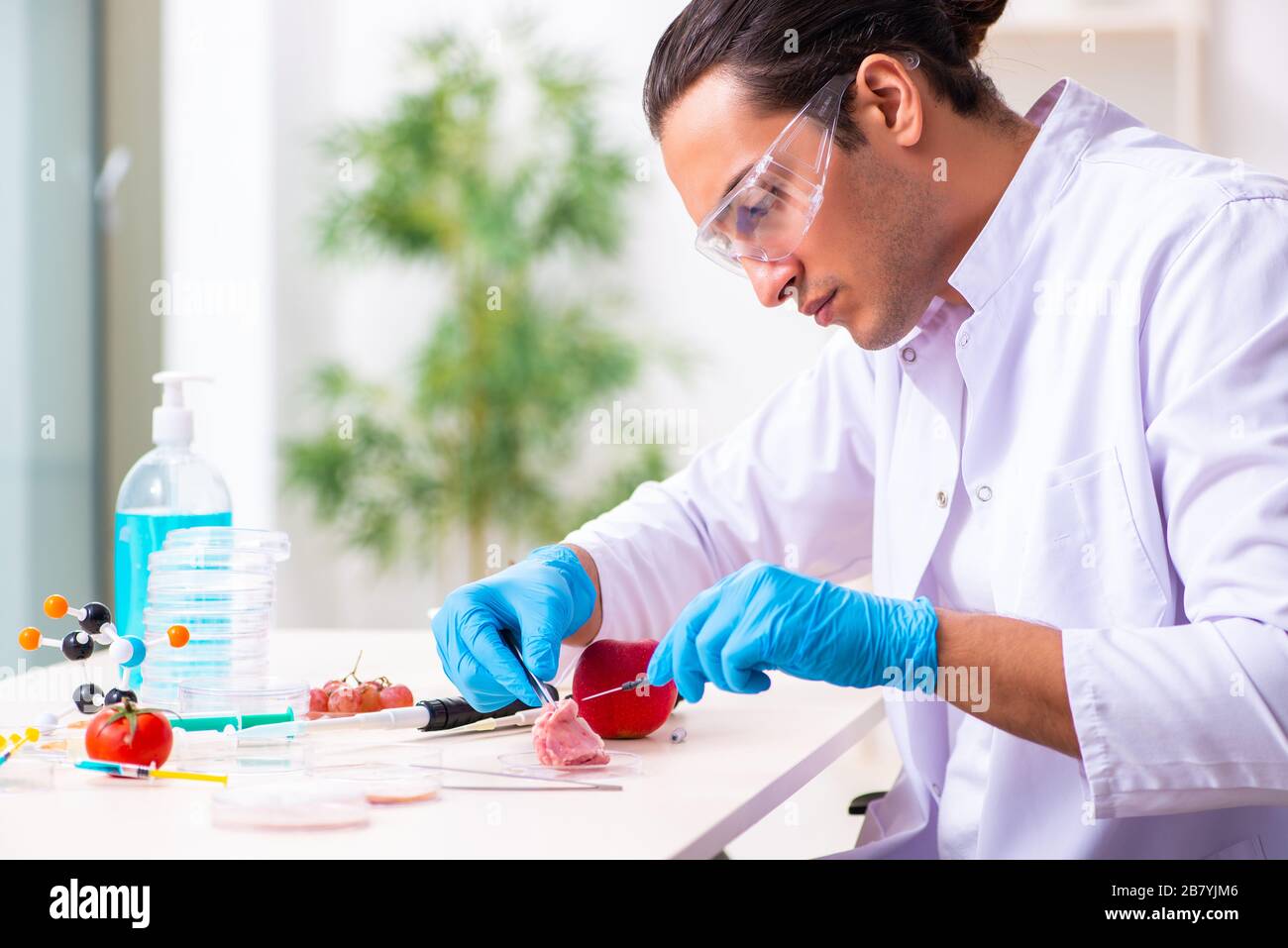 Young nutrition expert testing food products in lab Stock Photo - Alamy