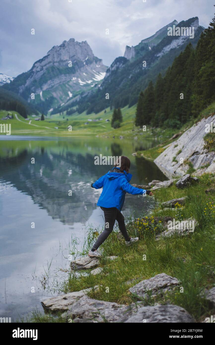 Young woman walking lake in hi-res stock photography and images - Alamy