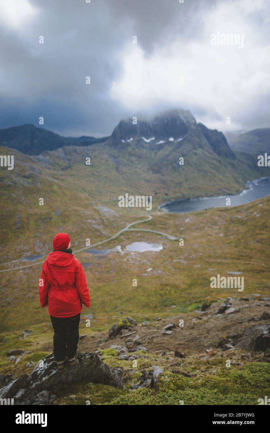 Person in red jacket hi-res stock photography and images - Alamy