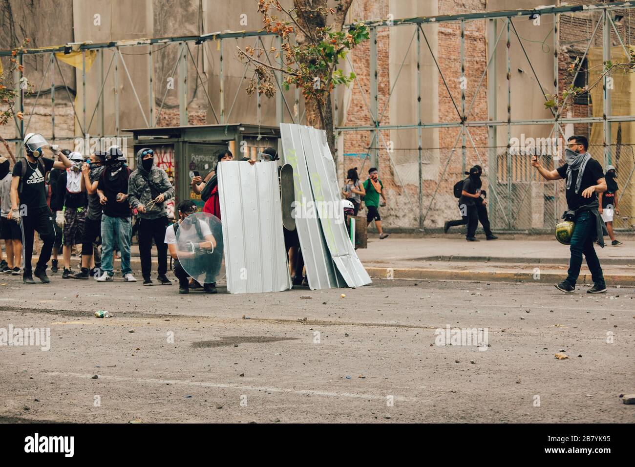 SANTIAGO, CHILE-NOVEMBER 8, 2019 - Protesters protect themselves from ...