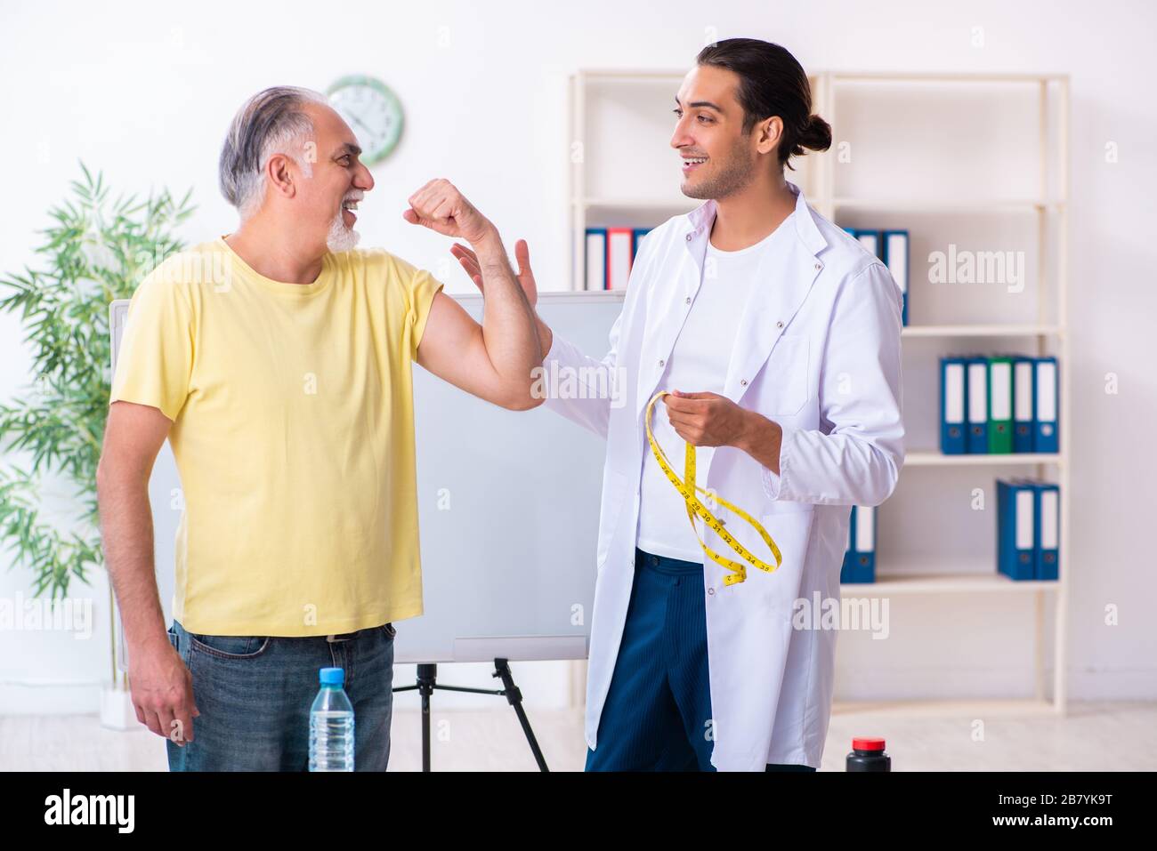 The doctor dietician giving advices to fat overweight patient Stock ...