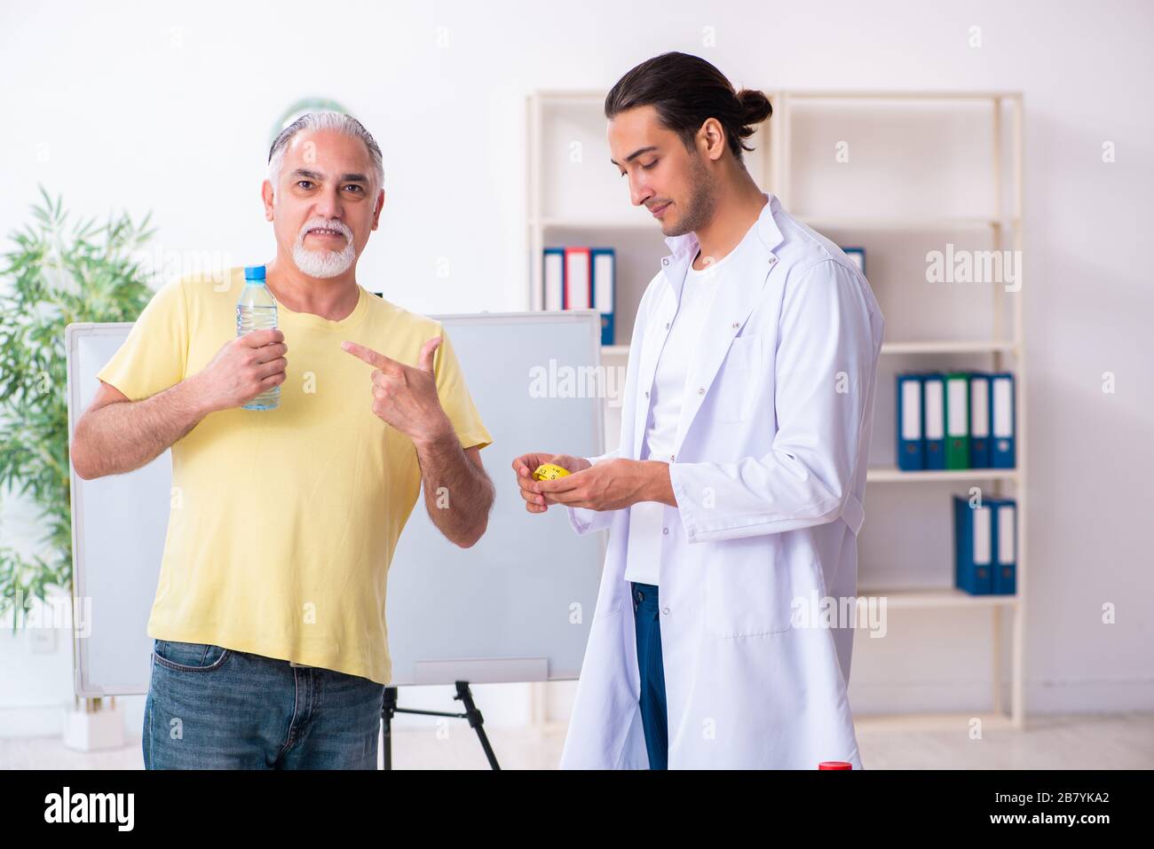 The doctor dietician giving advices to fat overweight patient Stock ...