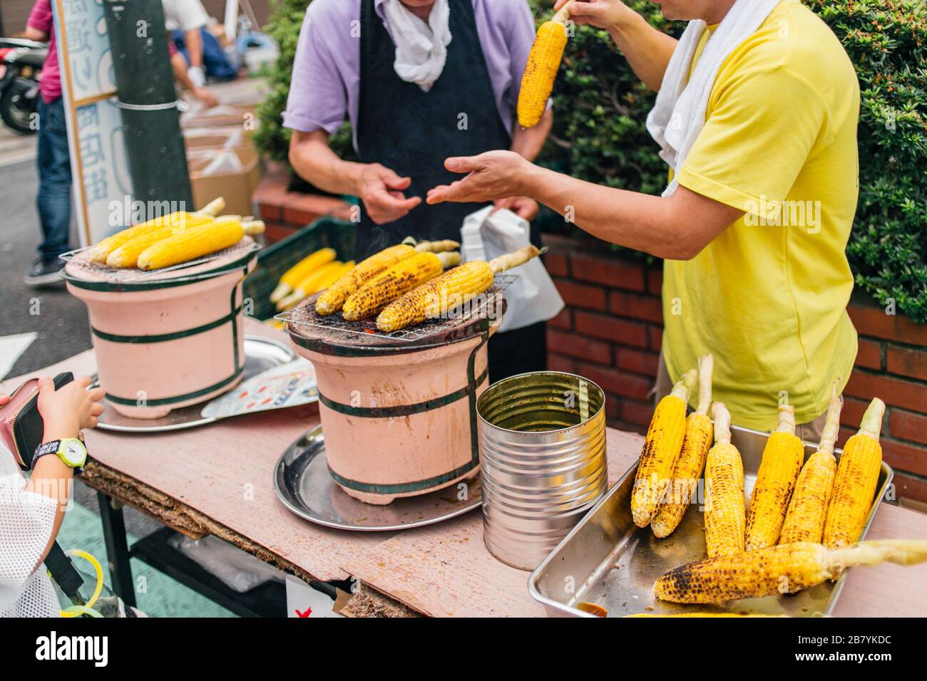 Cooking grilled corn at Japanese summer festival in a small town Stock ...