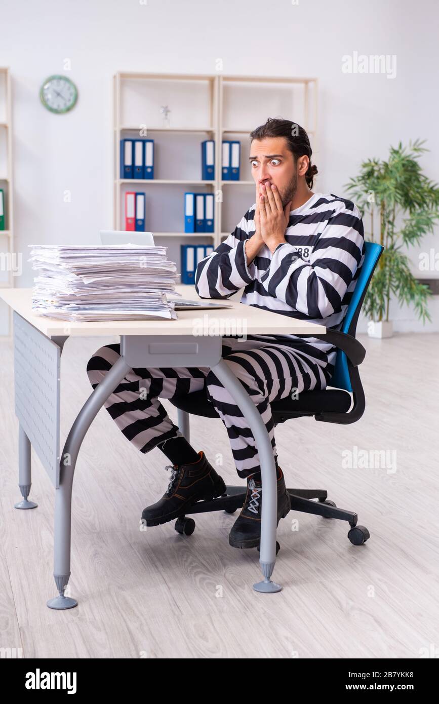 The young employee feeling like prisoner at work Stock Photo - Alamy