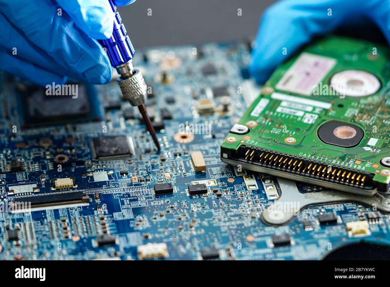Technician repairing micro circuit main board computer electronic ...