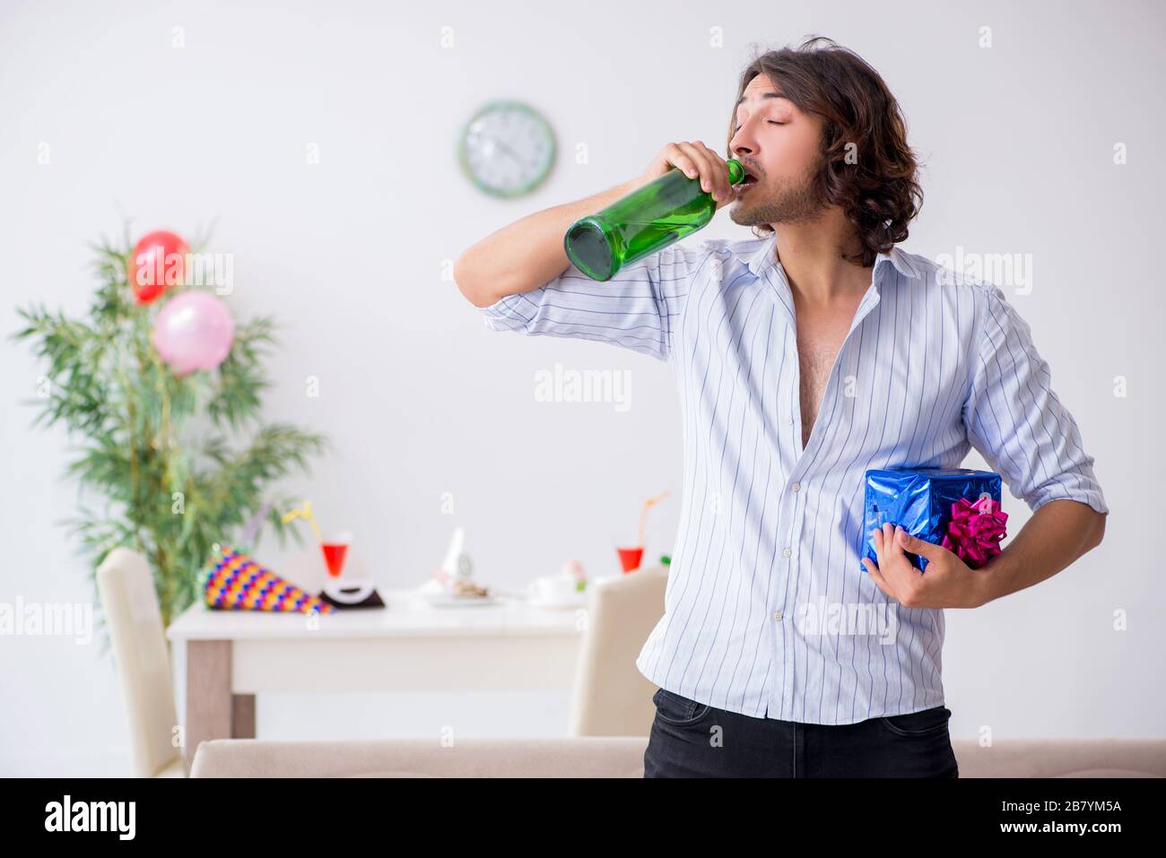 The young man celebrating his birthday at home Stock Photo - Alamy