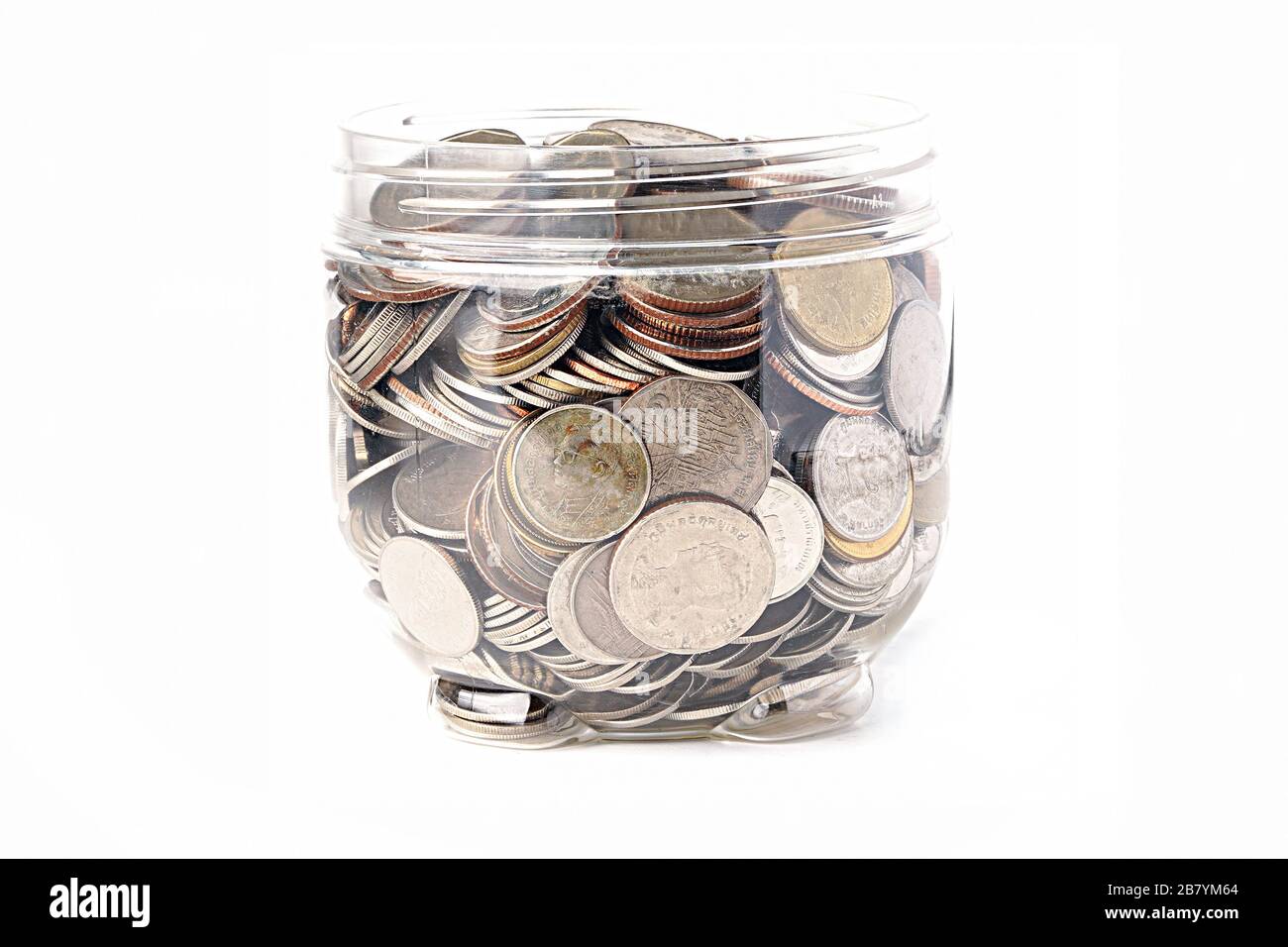 Coins in plastic bottle on white background Stock Photo - Alamy