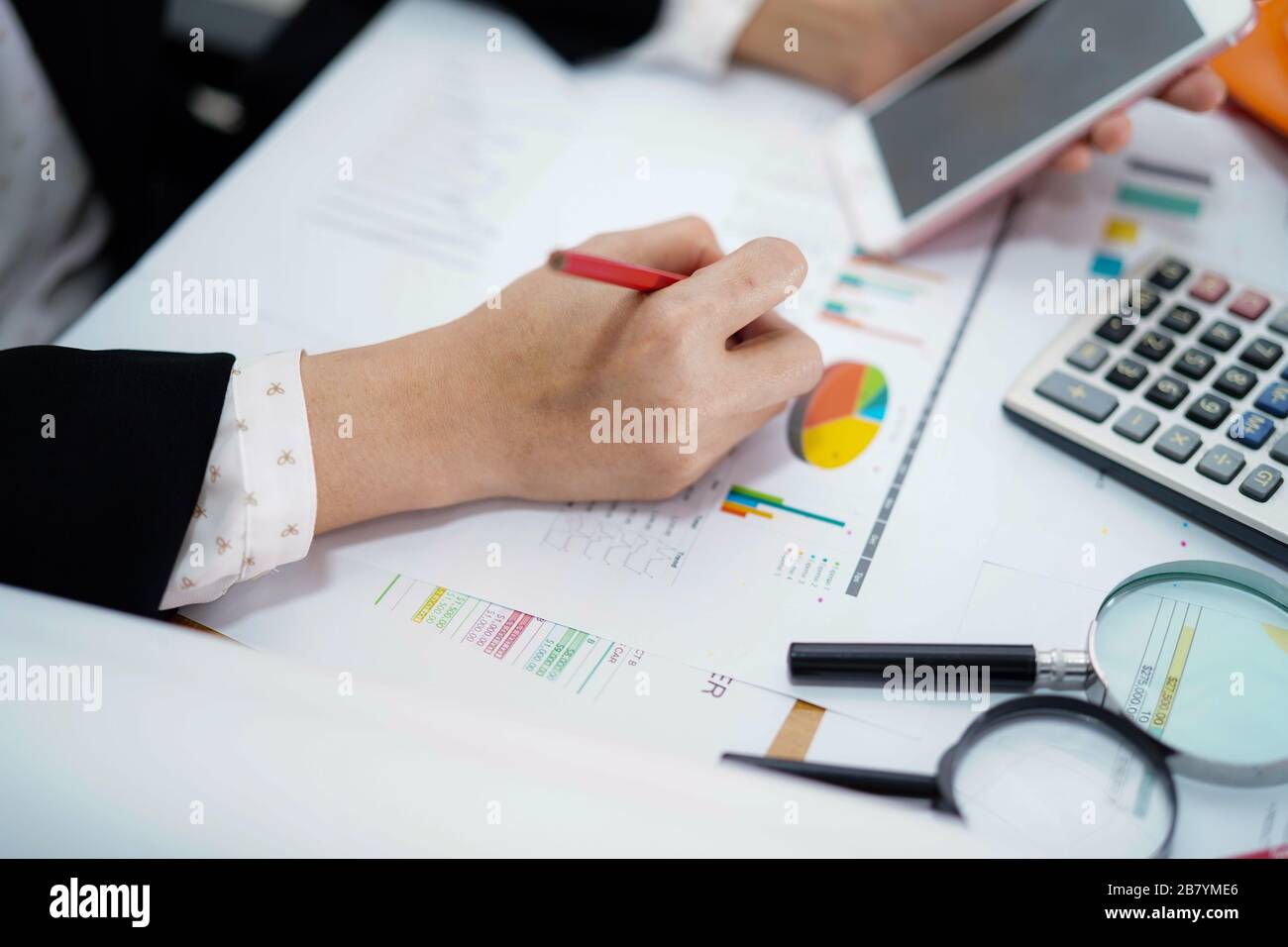 Accountant working project accounting with graph in modern office Stock ...