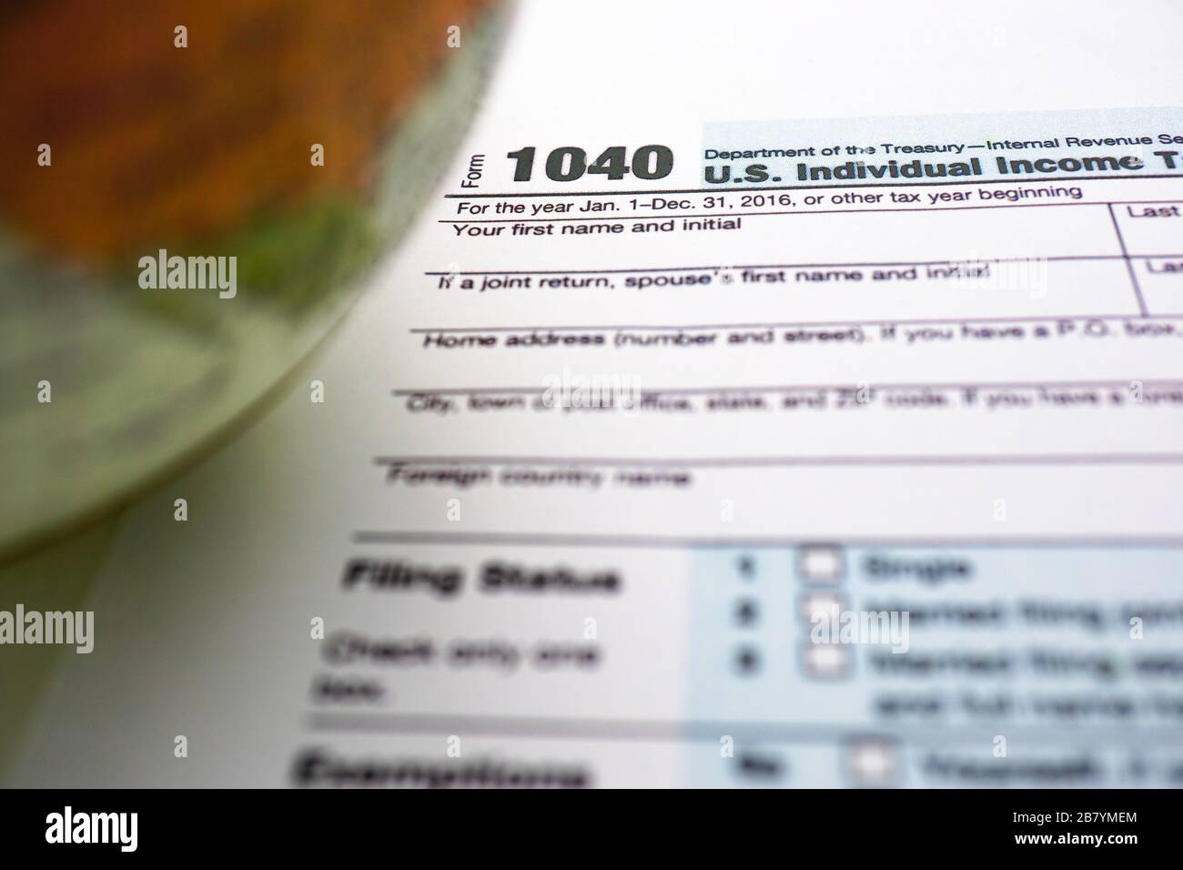 Tax Return form 1040 and dollar banknote : U.S. Individual Income Stock ...