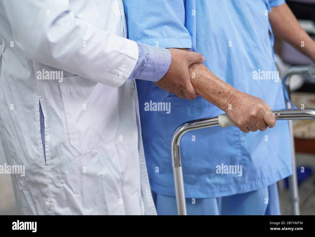 Doctor help asian senior or elderly old lady woman patient walk with ...