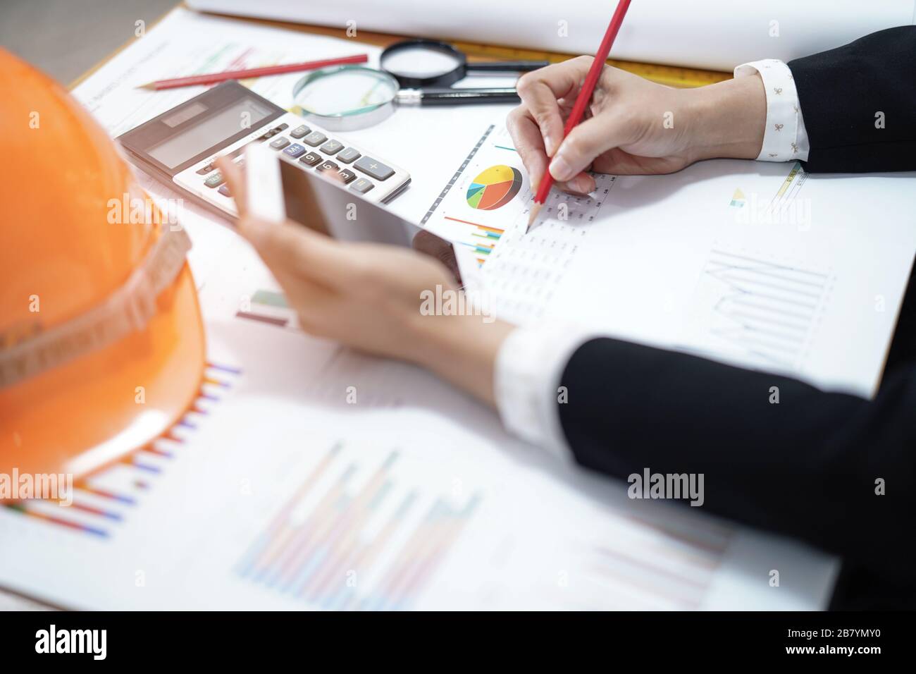 Accountant working project accounting with graph in modern office Stock ...