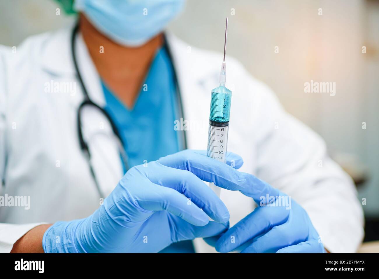 Doctor holding syringe with vaccine development medical for doctor use ...