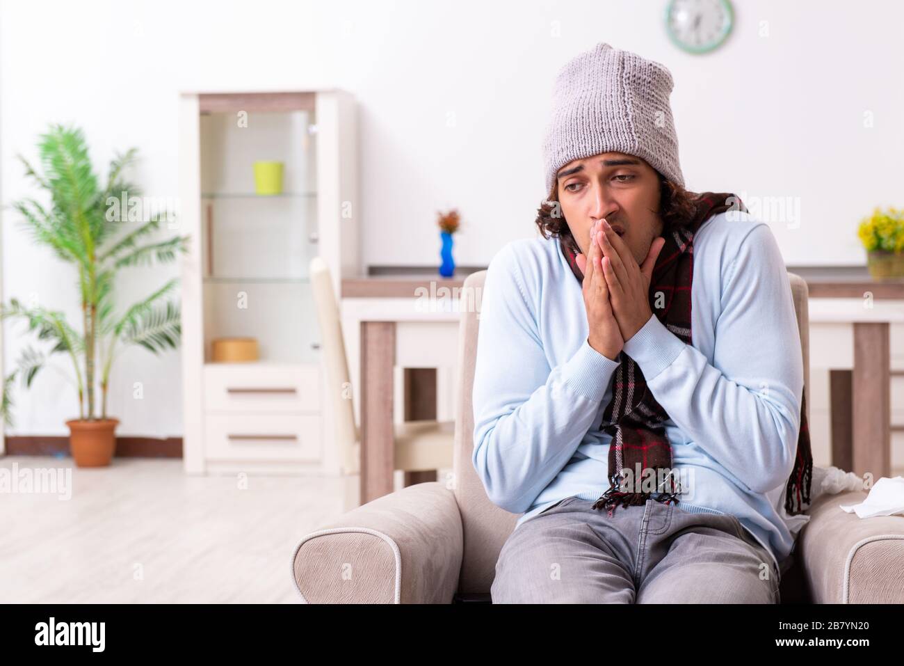Young man suffering from flu at the home Stock Photo - Alamy