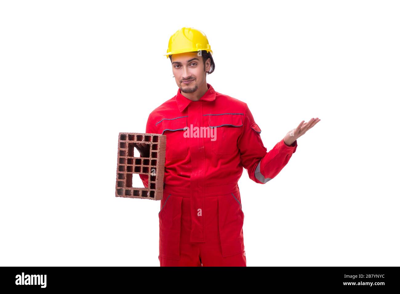 Young male builder showing brick hi-res stock photography and images ...